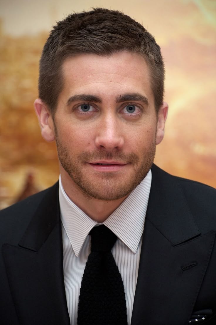 Man with heart-shaped face demonstrating balanced buzz cut